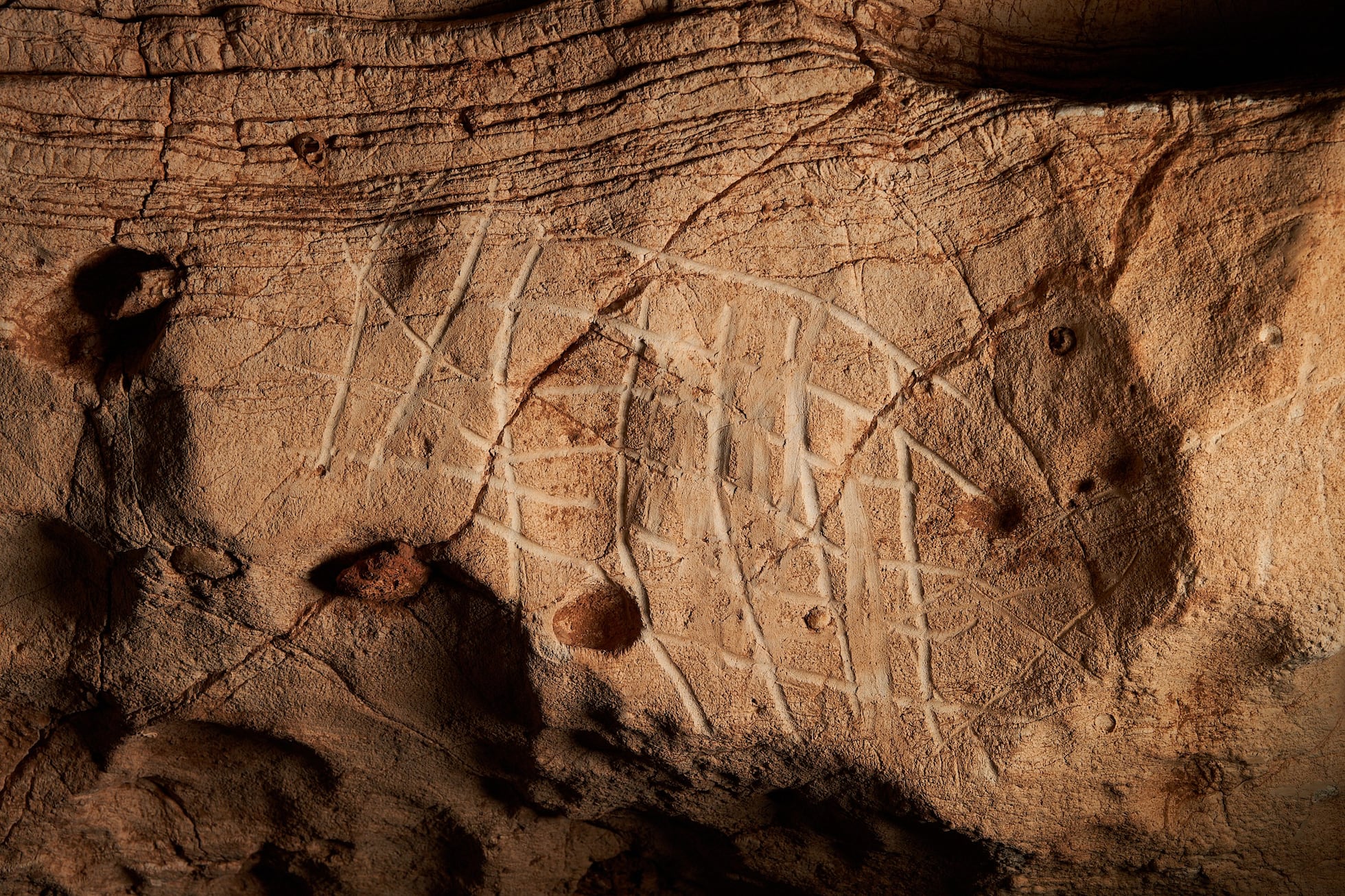 Over 100 prehistoric engravings found in a cave in northeastern Spain ...