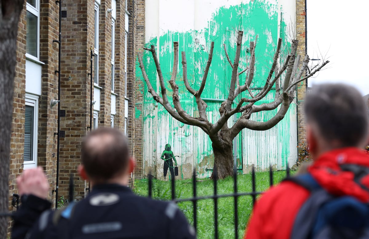 A new Banksy mural sprouts beside a cropped tree in London. Many see an ...